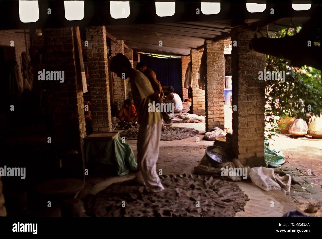 Kneading clay for pots Stock Photo - Alamy