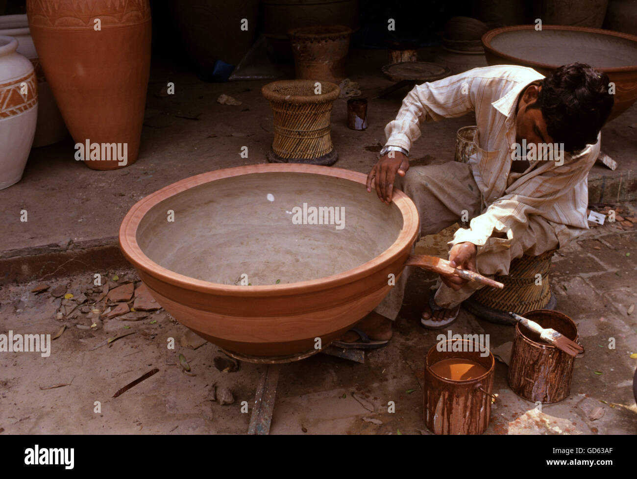 Colouring Clay pots Stock Photo - Alamy