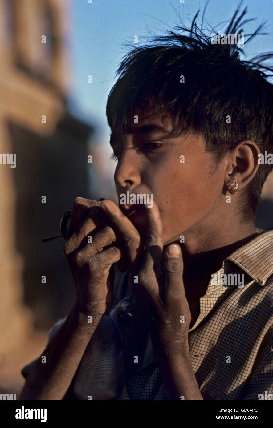 Boy playing Jew's harp Stock Photo - Alamy