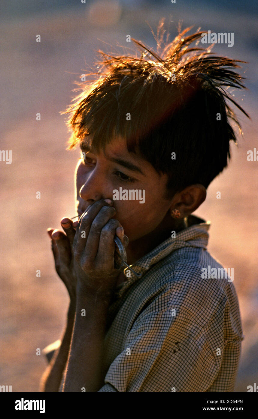 Boy playing Jew's harp Stock Photo - Alamy