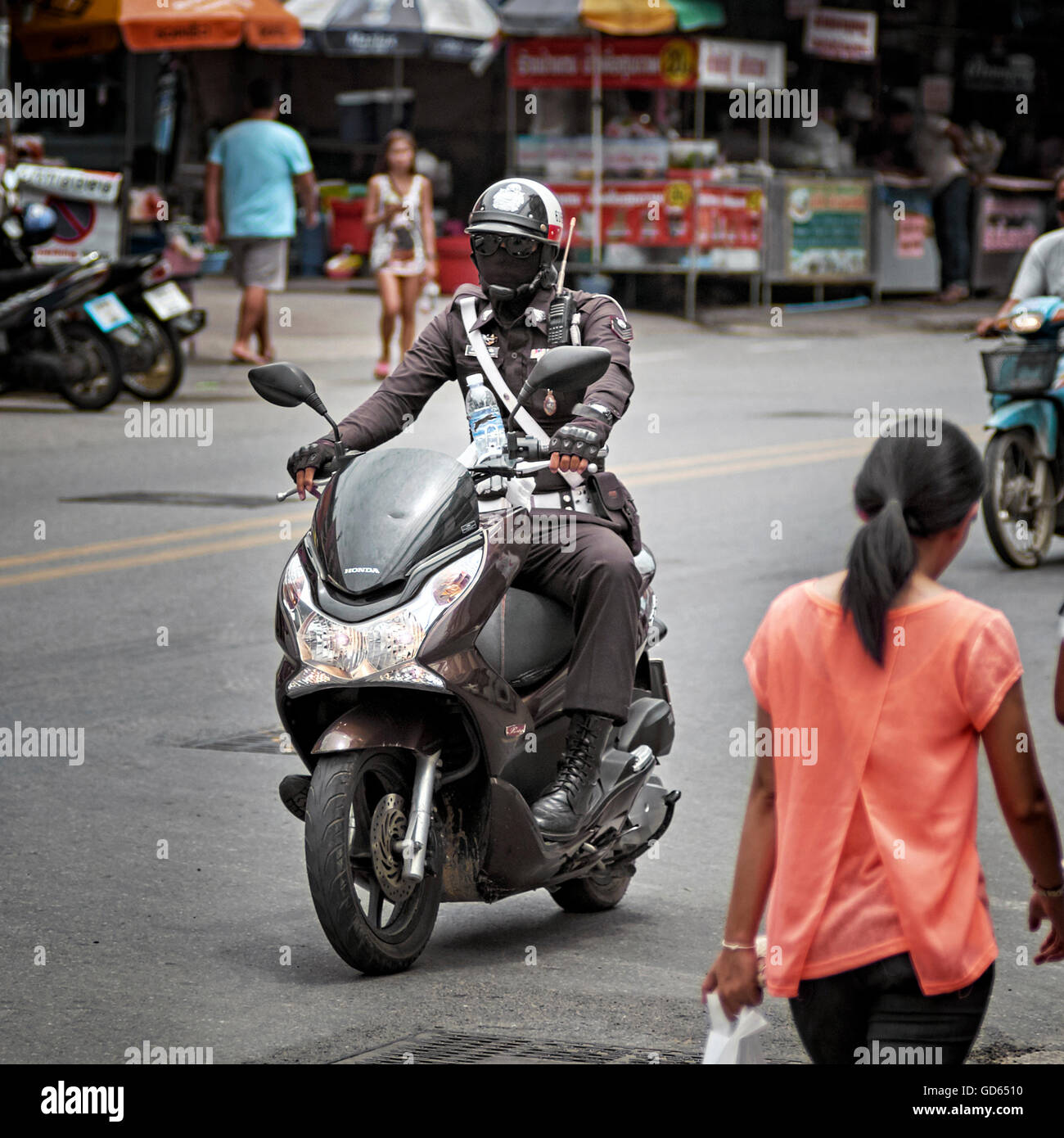 Thailand policeman riding motorcycle. Thailand S. E. Asia Stock Photo ...
