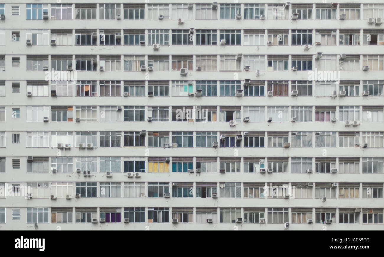 Multiple closed windows on a large building Stock Photo - Alamy