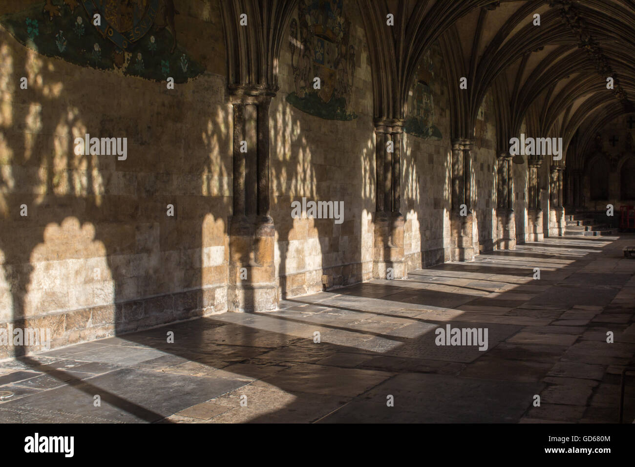 cloisters at norwich cathedral shadows Stock Photo - Alamy