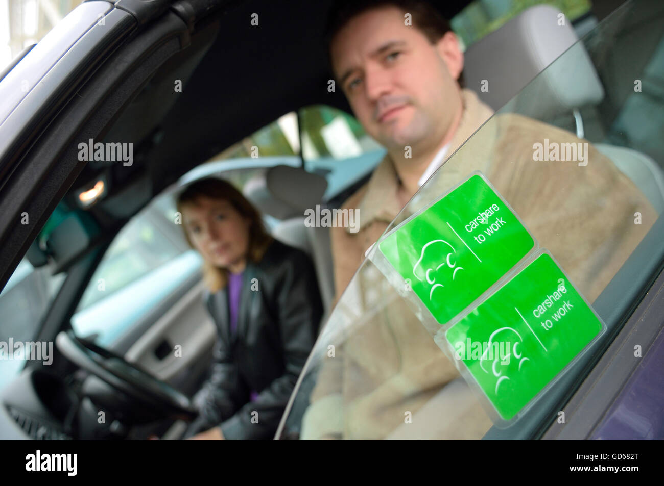 A couple car sharing for their commute to work. England. UK Stock Photo ...