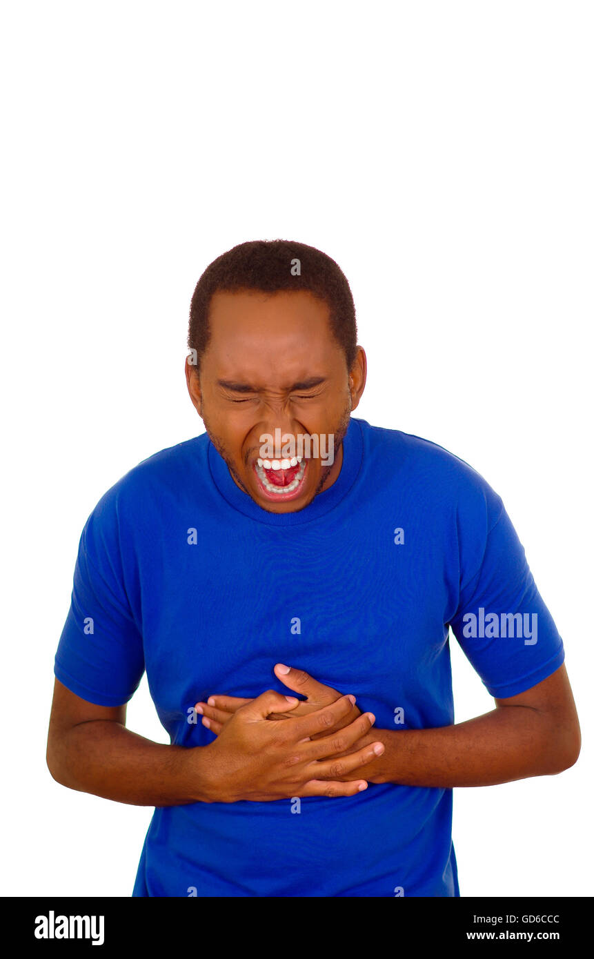 Man wearing strong blue t-shirt standing and laughing hard holding his ...