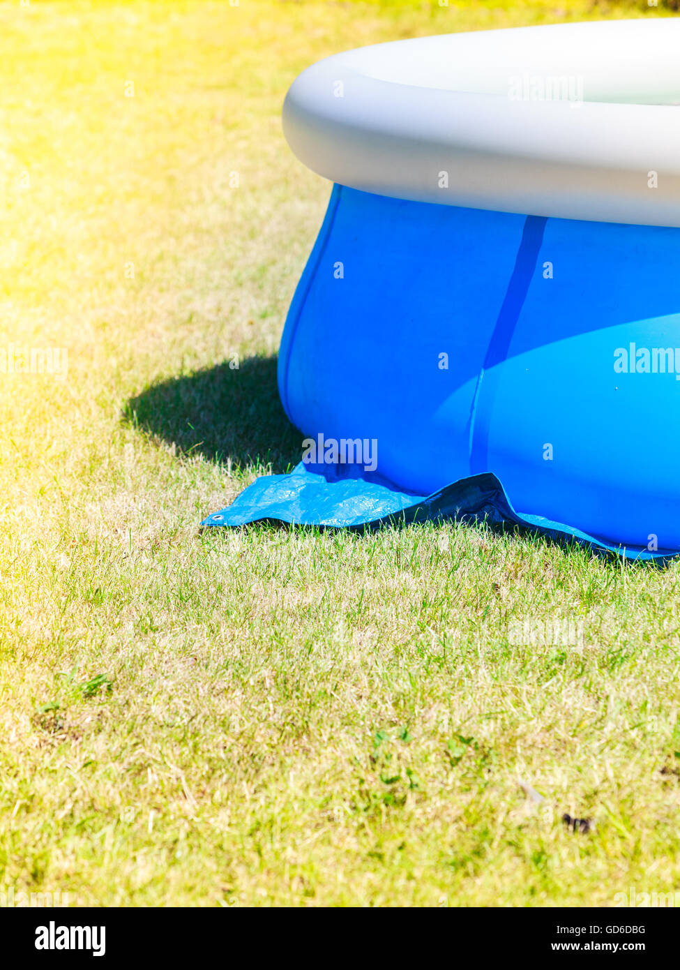 inflatable blue water pool on grass in garden Stock Photo - Alamy