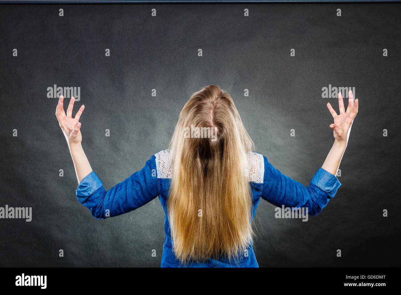 Fury and big anger inside of people. Blonde furious woman making hands ...