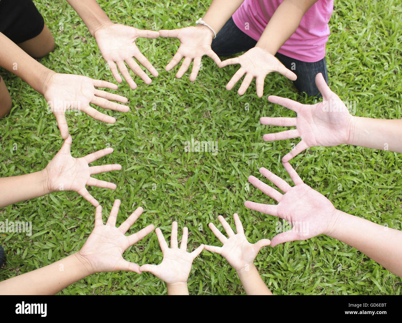 Children hands on green grass background, spring time Stock Photo - Alamy