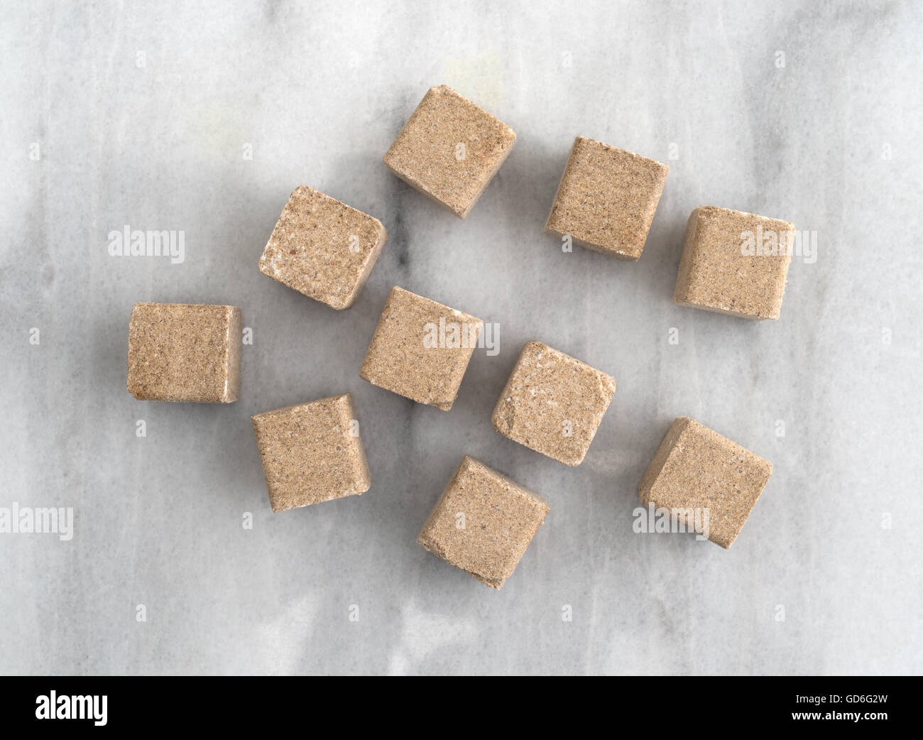 Top view of beef flavored bouillon cubes gray marble cutting board ...
