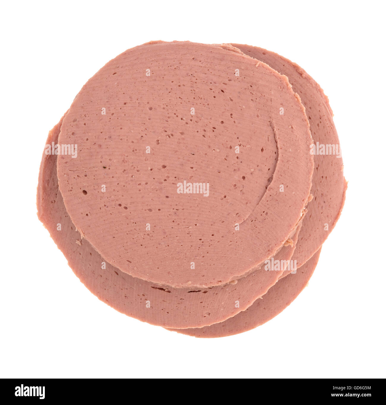 Several slices of chicken bologna in a stack on a white background top ...