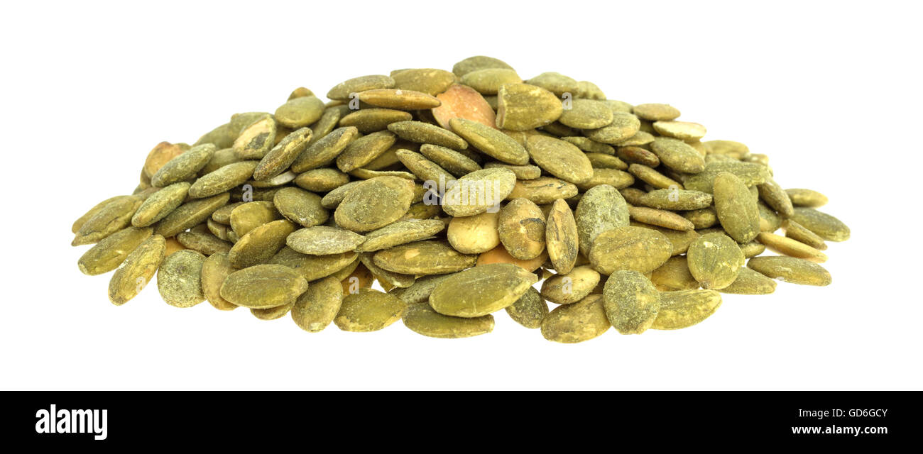 A portion of organic dry roasted pumpkin seeds isolated on a white ...