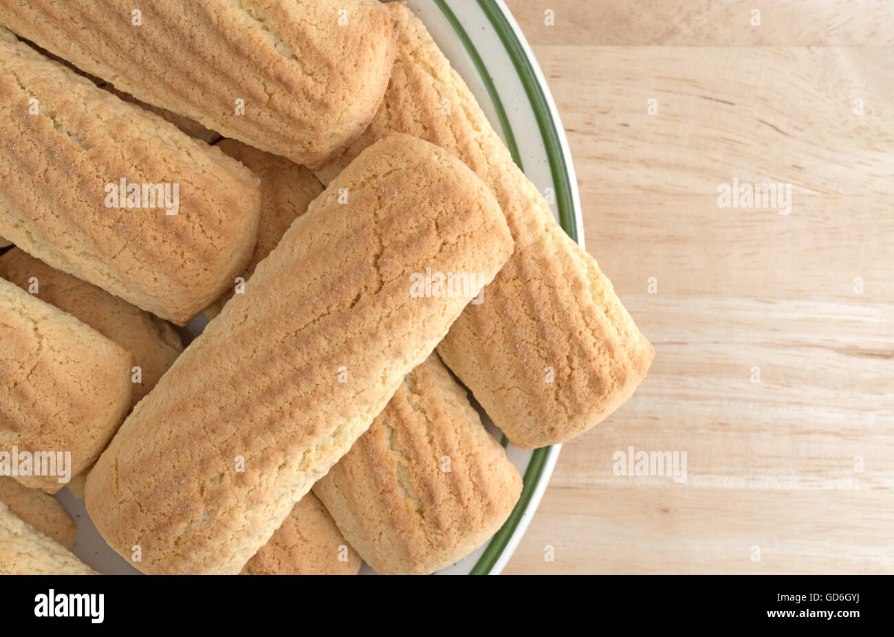 Top close view of a group of vanilla cookie bars on a green striped ...
