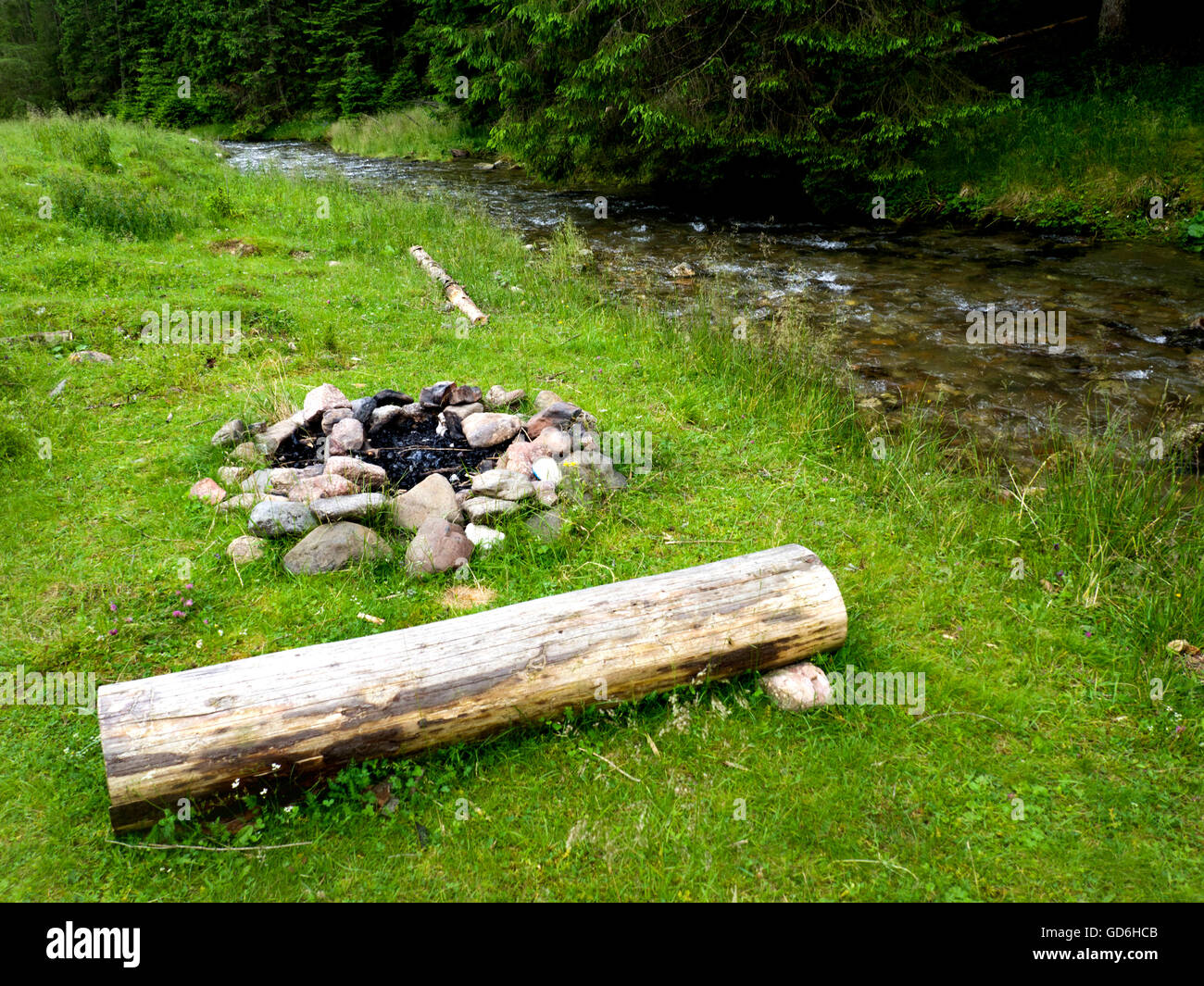fire camp by mountain river Stock Photo - Alamy