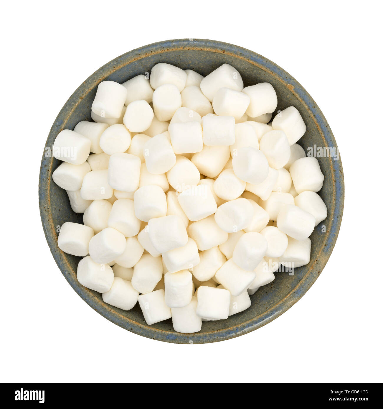 Top view of small bite size marshmallows filling an old stoneware bowl ...
