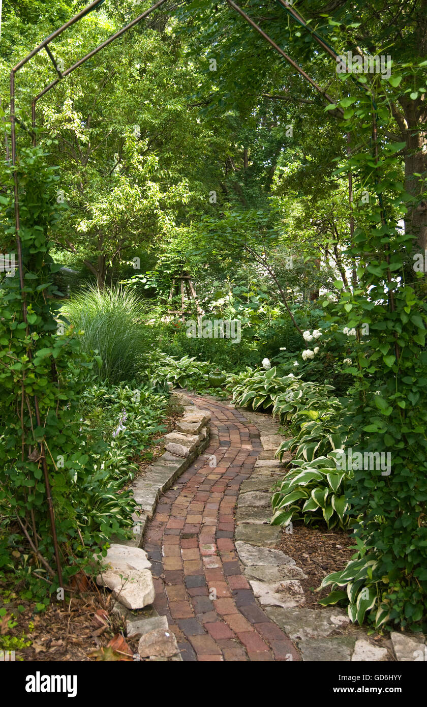 BRICK PATH THROUGH SHADE GARDEN Stock Photo - Alamy