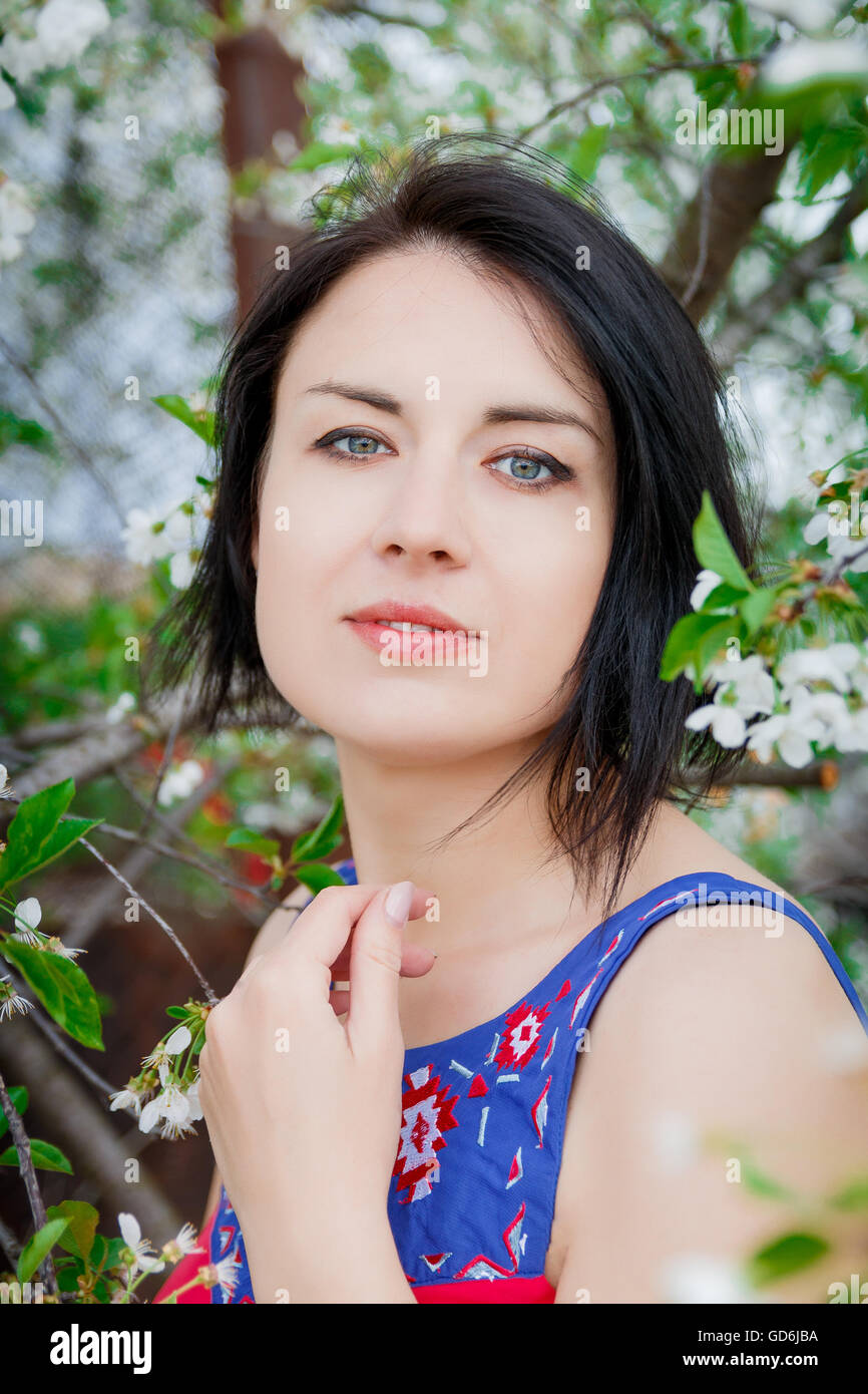 Beautiful woman among blossoming cherry tree. girl among the blooming ...