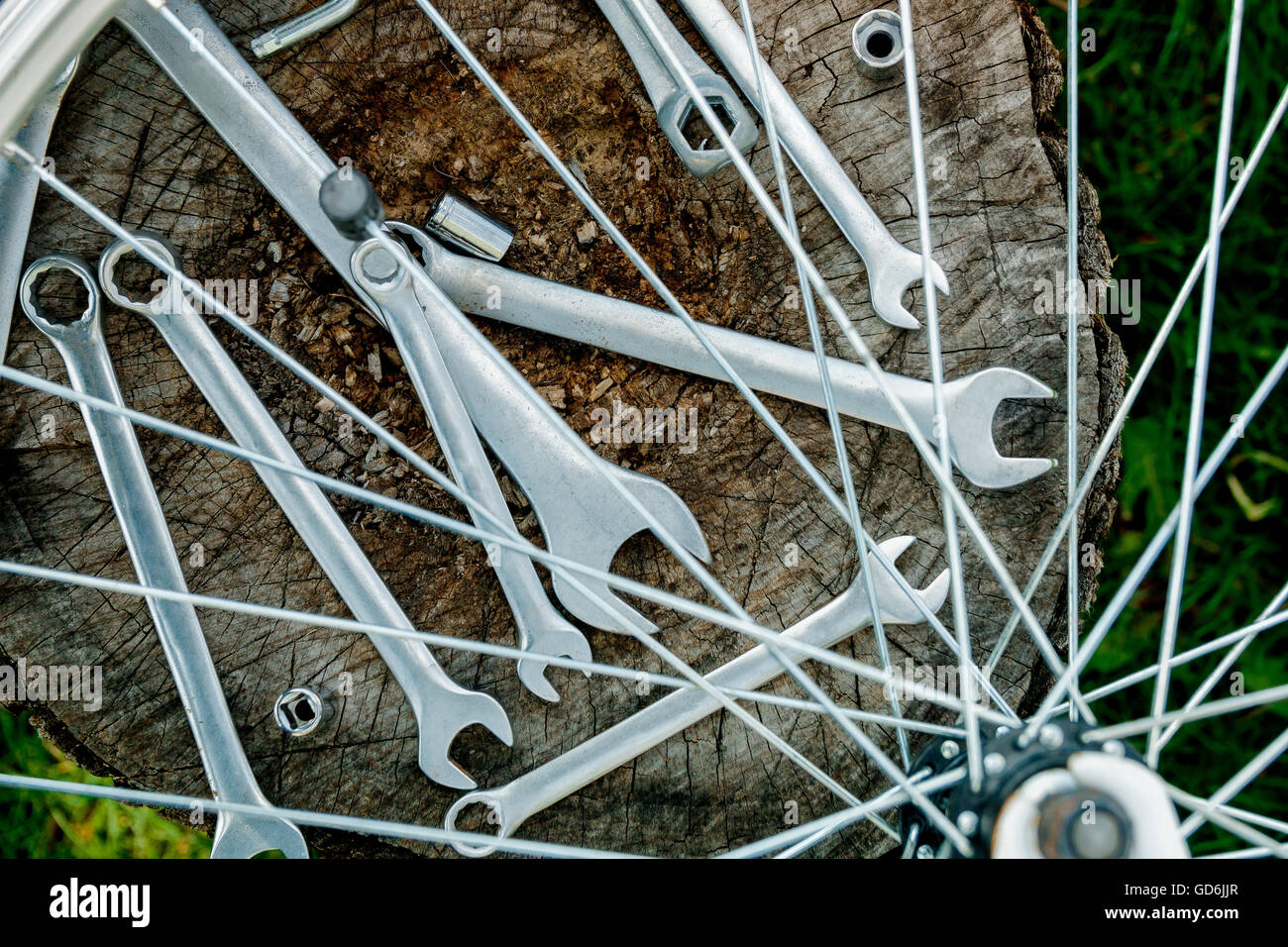 Tools, instrument for repairing bike on the wooden background outdoor ...
