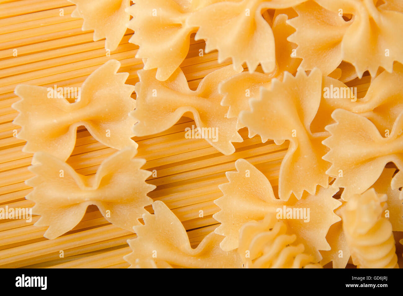 Raw pasta background. Mixed dried pasta selection on black wooden ...