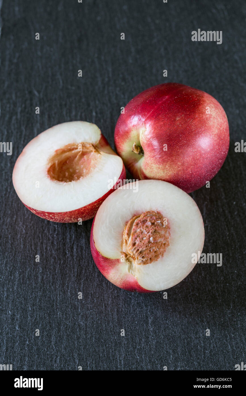 White Flesh Nectarine on a dark background Stock Photo - Alamy