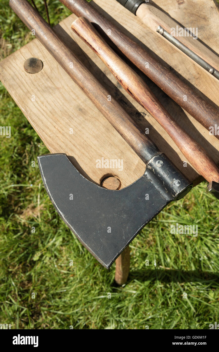 Group of medieval weapons outdoors, focusing on an axe Stock Photo - Alamy