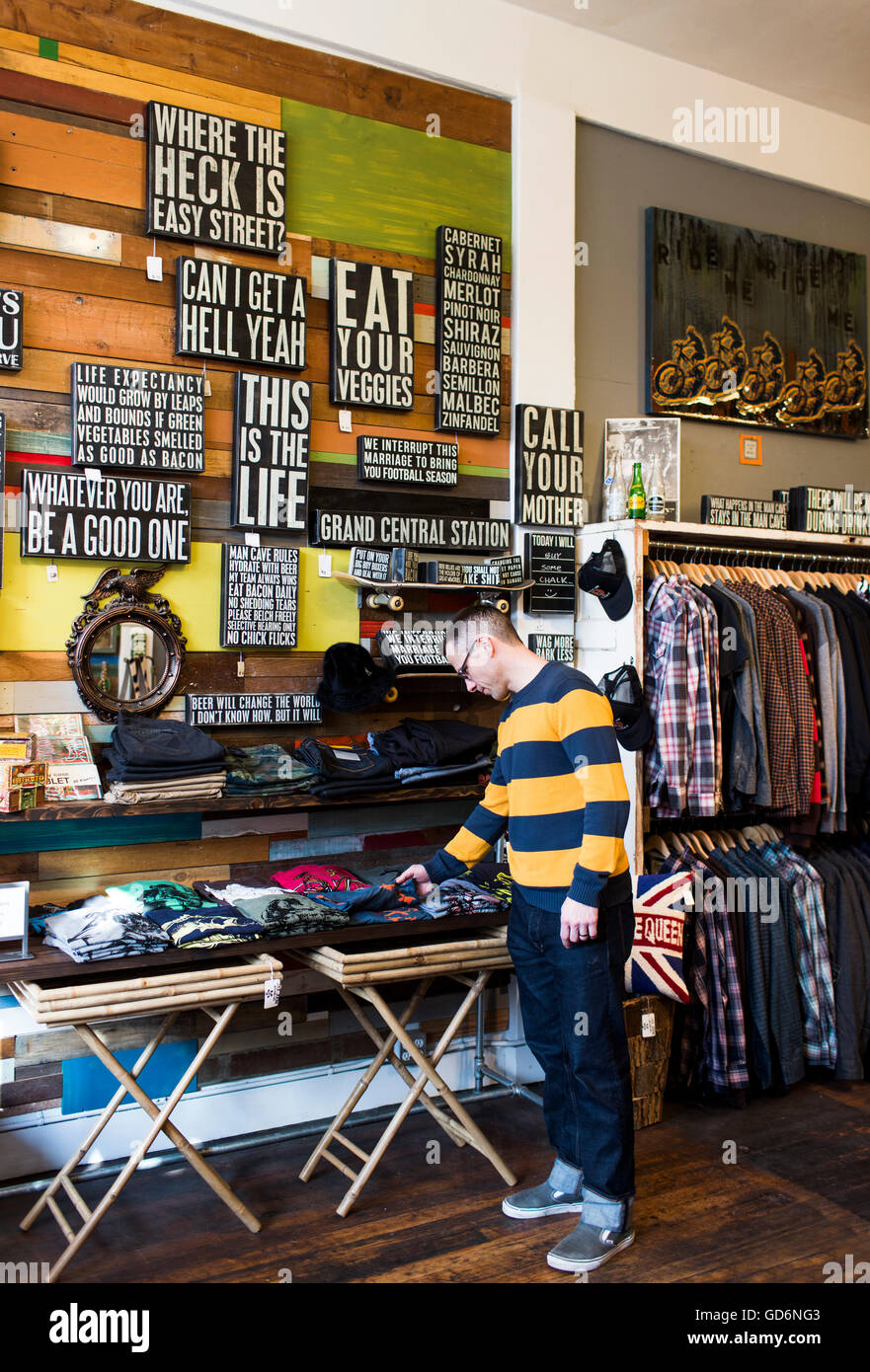 A man shops inside a store in Ballard, a neighborhood of Seattle, WA ...