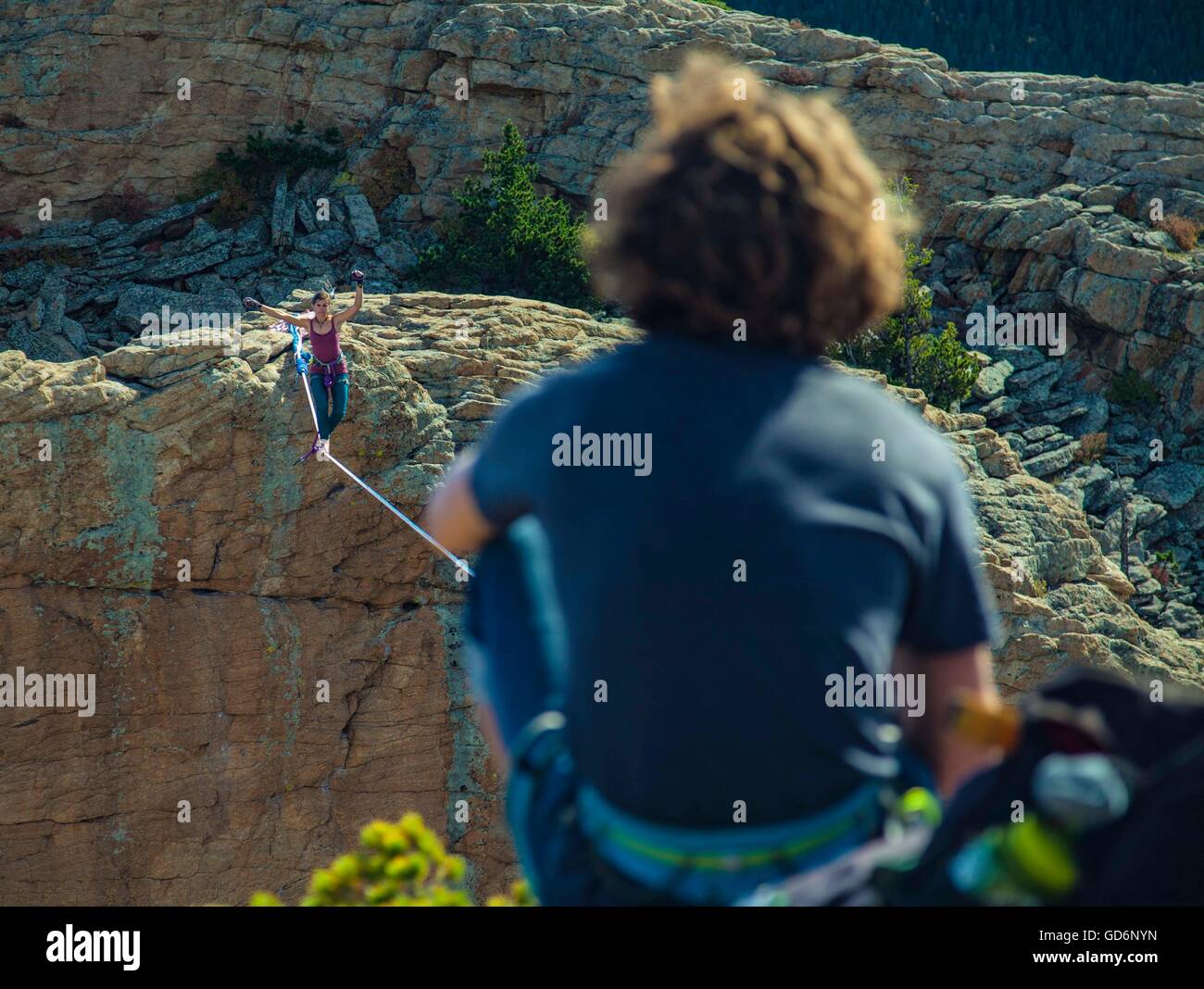 Woman highlining while friends watch in Colorado Stock Photo - Alamy