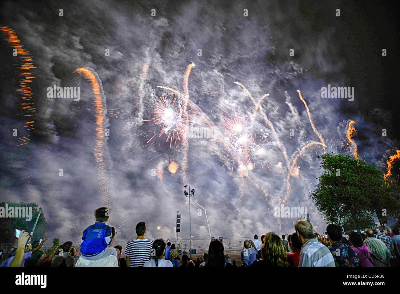 People watching fireworks show Stock Photo - Alamy
