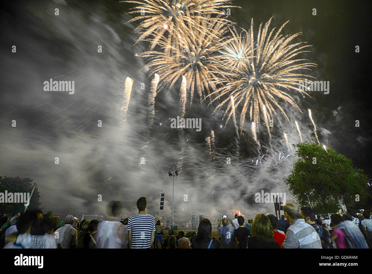 People watching fireworks show Stock Photo - Alamy