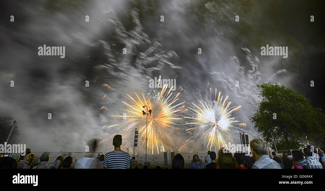 People watching fireworks show Stock Photo - Alamy