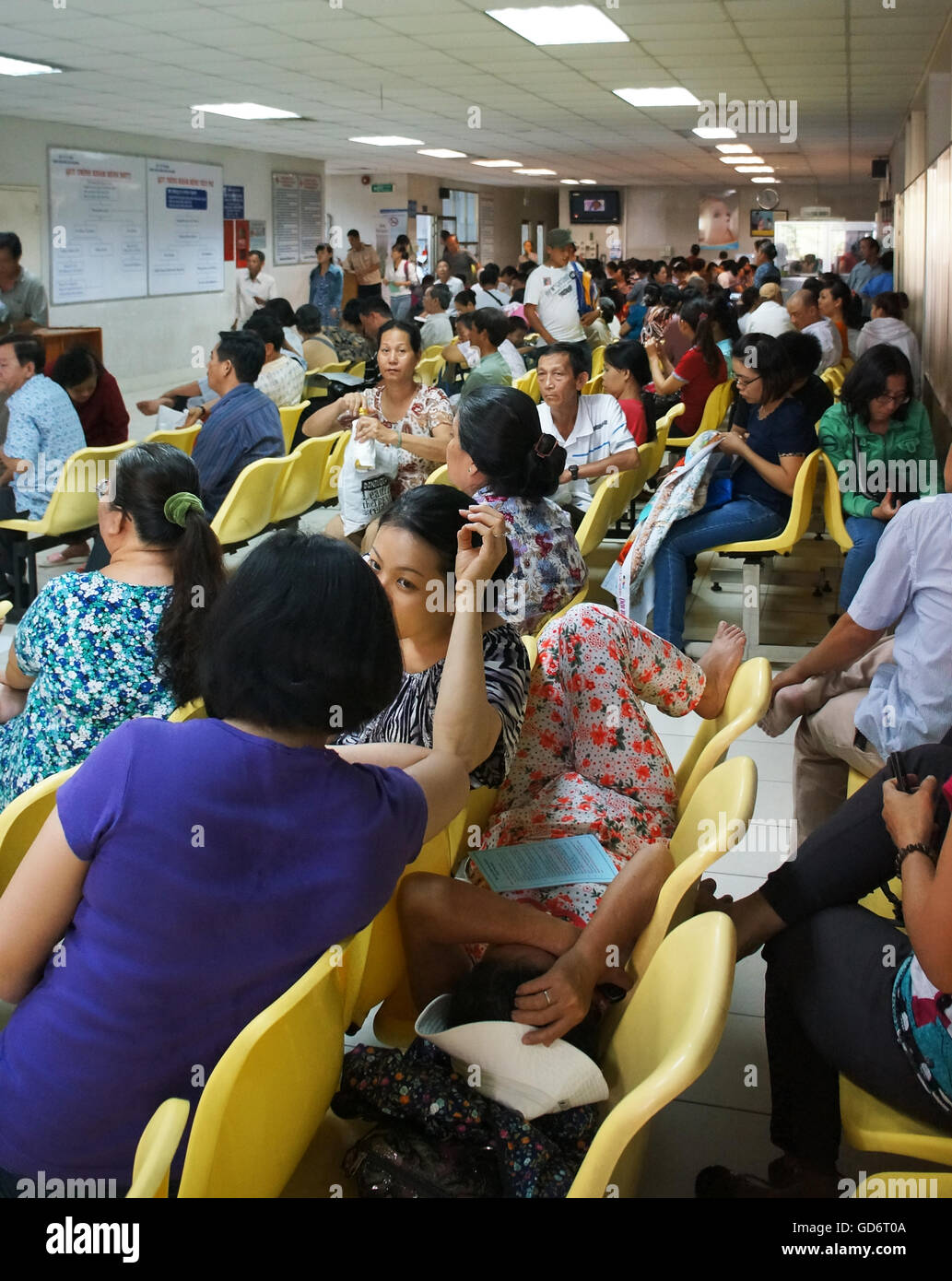 Crowd of people sitting and waiting to examine health, sick patient sit ...