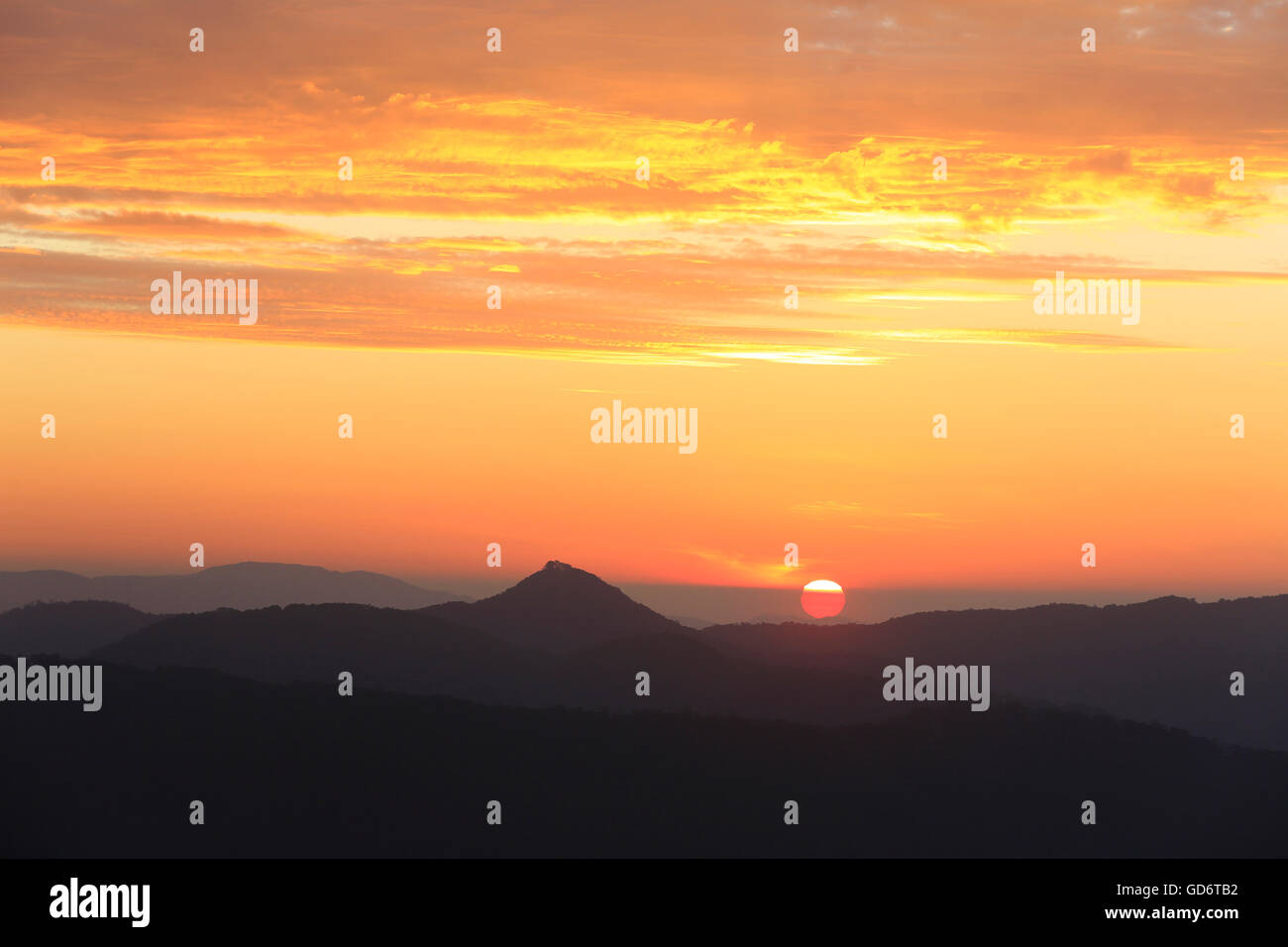 Dawn coming in top of mountain . Beauty world Stock Photo - Alamy