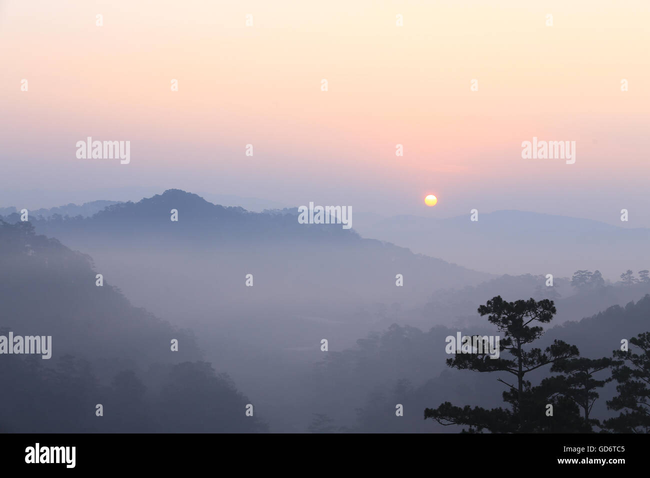 Dawn coming in top of mountain . Beauty world Stock Photo - Alamy