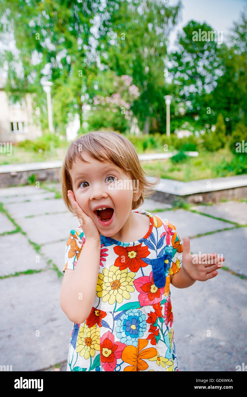 Surprised baby girl outside. Happy little girl screaming Stock Photo ...