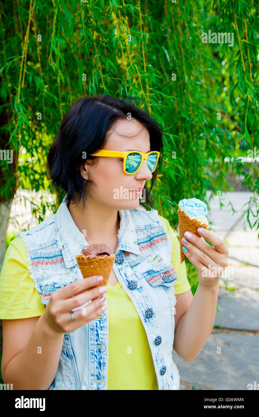 Young Girl Hold A Delicious Two Ice Creams In Summer Hot Weather