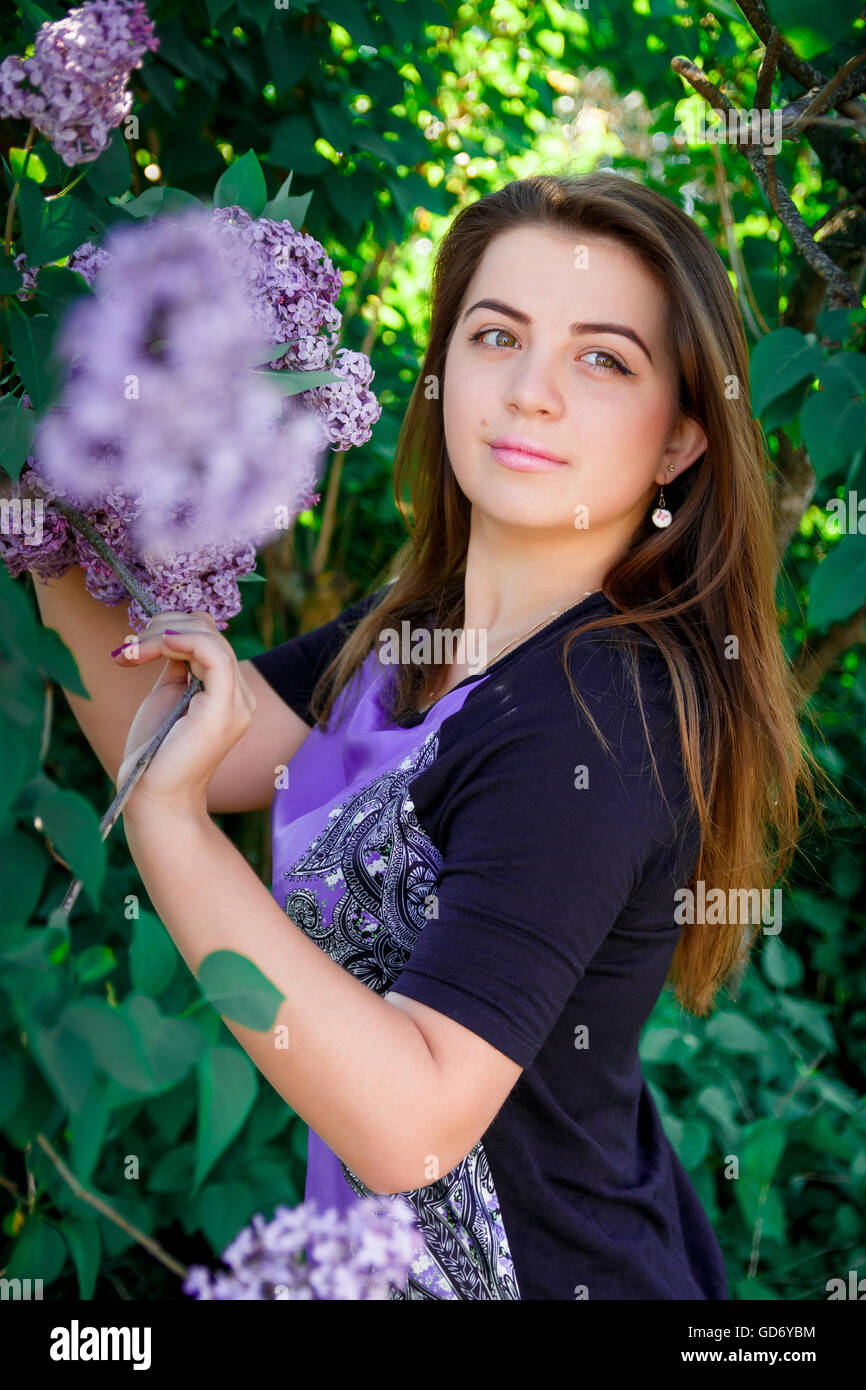 Portrait Of Beautiful Long Haired Dark Haired Girl In Purple Dress In
