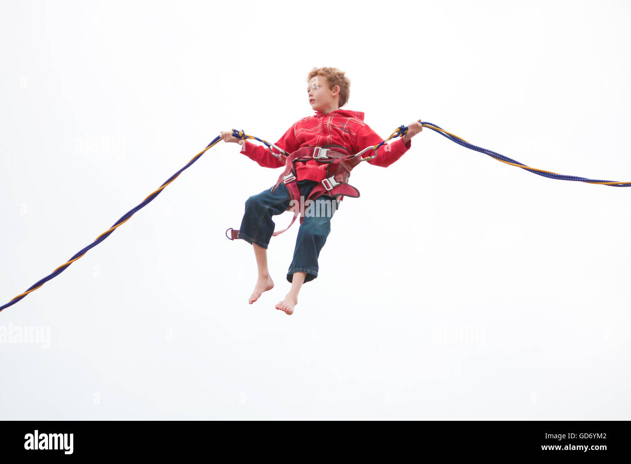Young boy jumping Stock Photo - Alamy