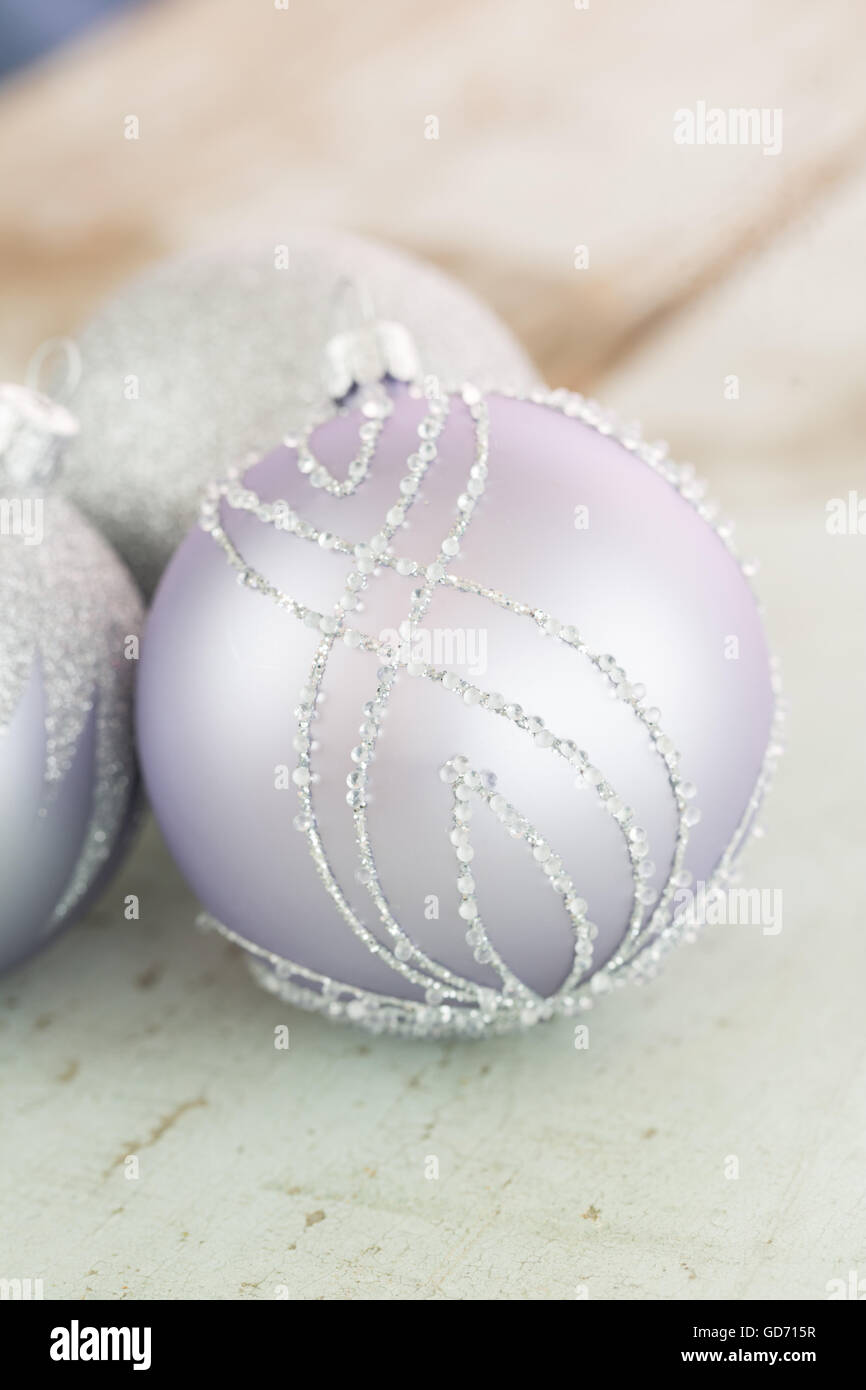 Decorated silver Christmas baubles with focus to a single bauble in the ...