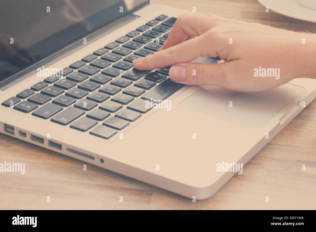 hands on laptop keyboard Stock Photo - Alamy