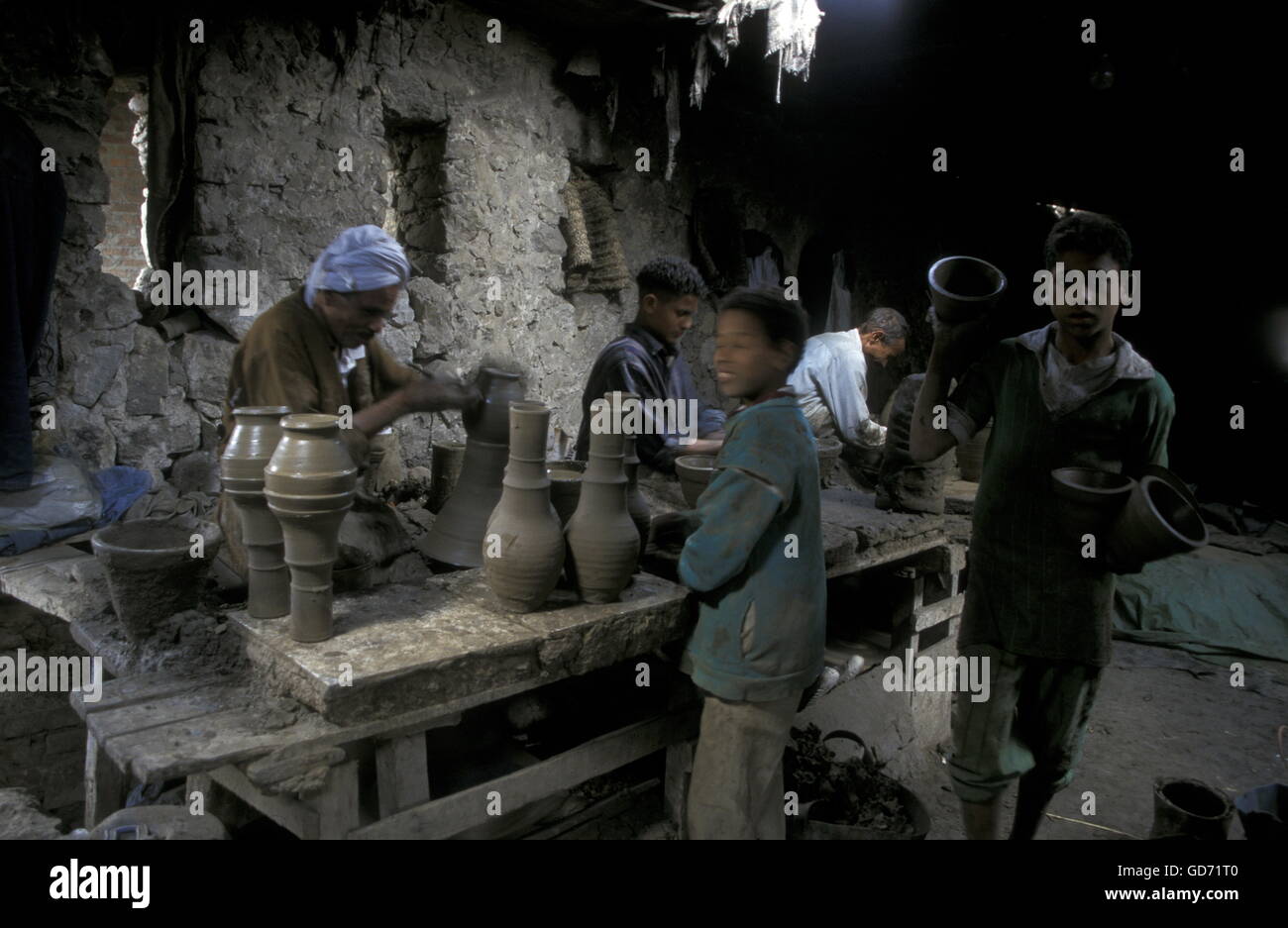 workers in a pottery factory in the old town of Cairo the capital of ...