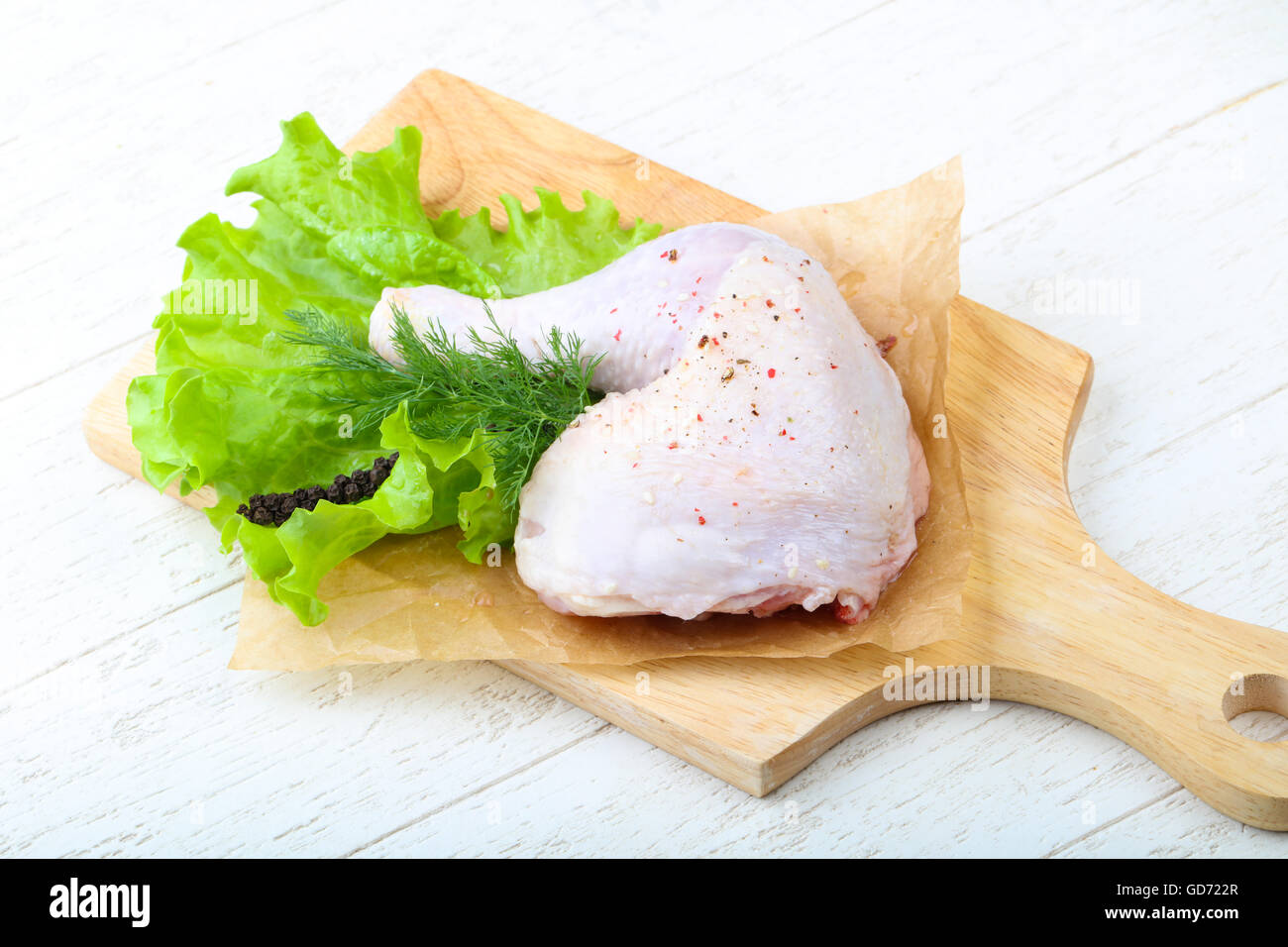 Raw chicken leg with herbs and spices ready for cooking Stock Photo - Alamy