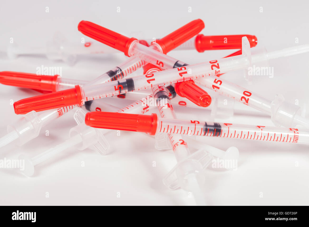 Still Life Close Up of Pile of Empty Syringe Needles with Red Safety ...