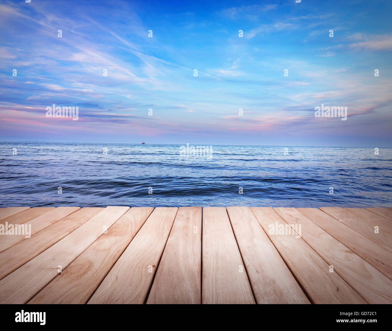 Empty wooden platform and beautiful sunset on the sea with a beautiful ...