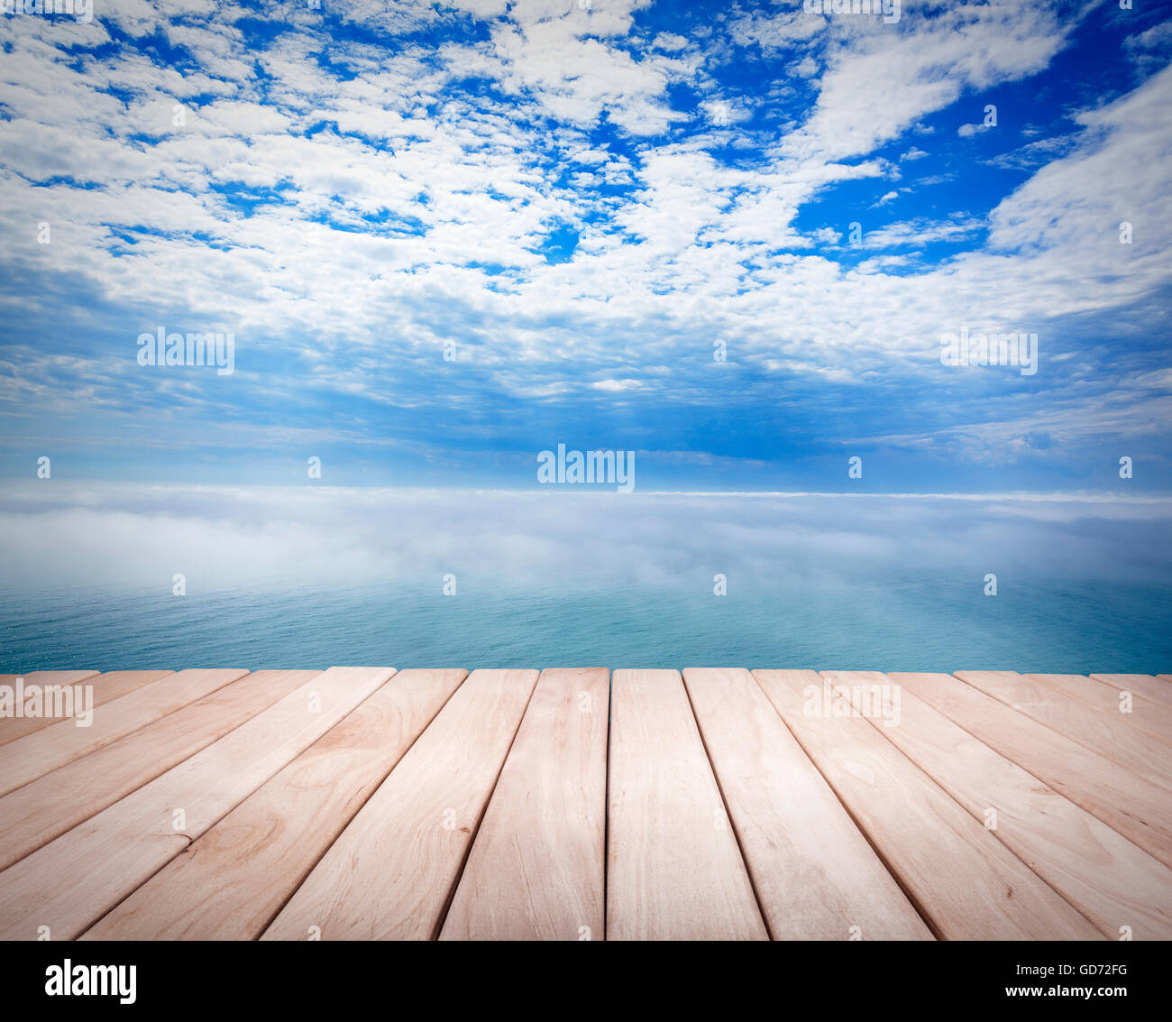 Empty wooden platform and seascape with a light fog and clouds Stock ...