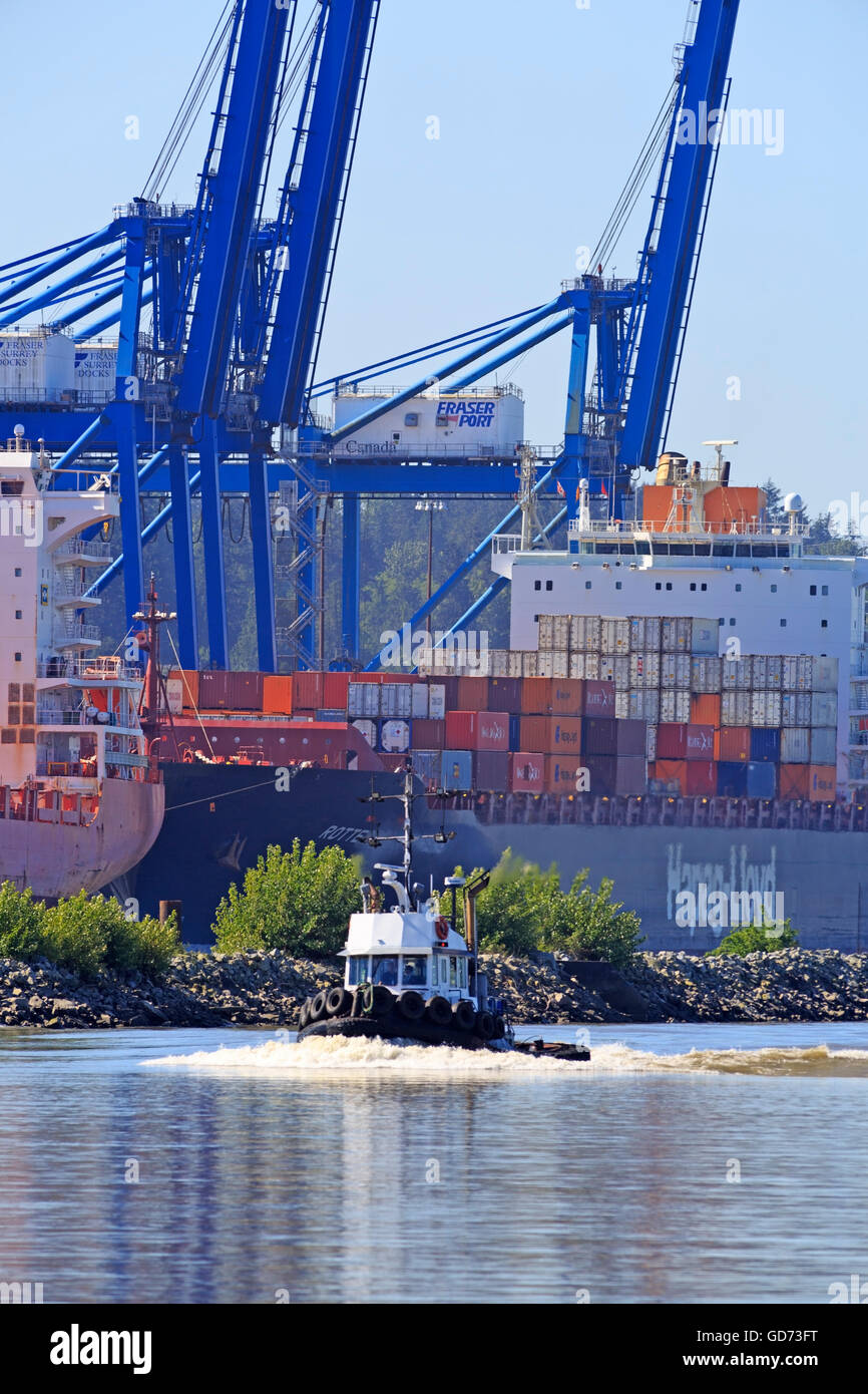 Tugboat and ships at container terminal on Fraser River, Surrey ...
