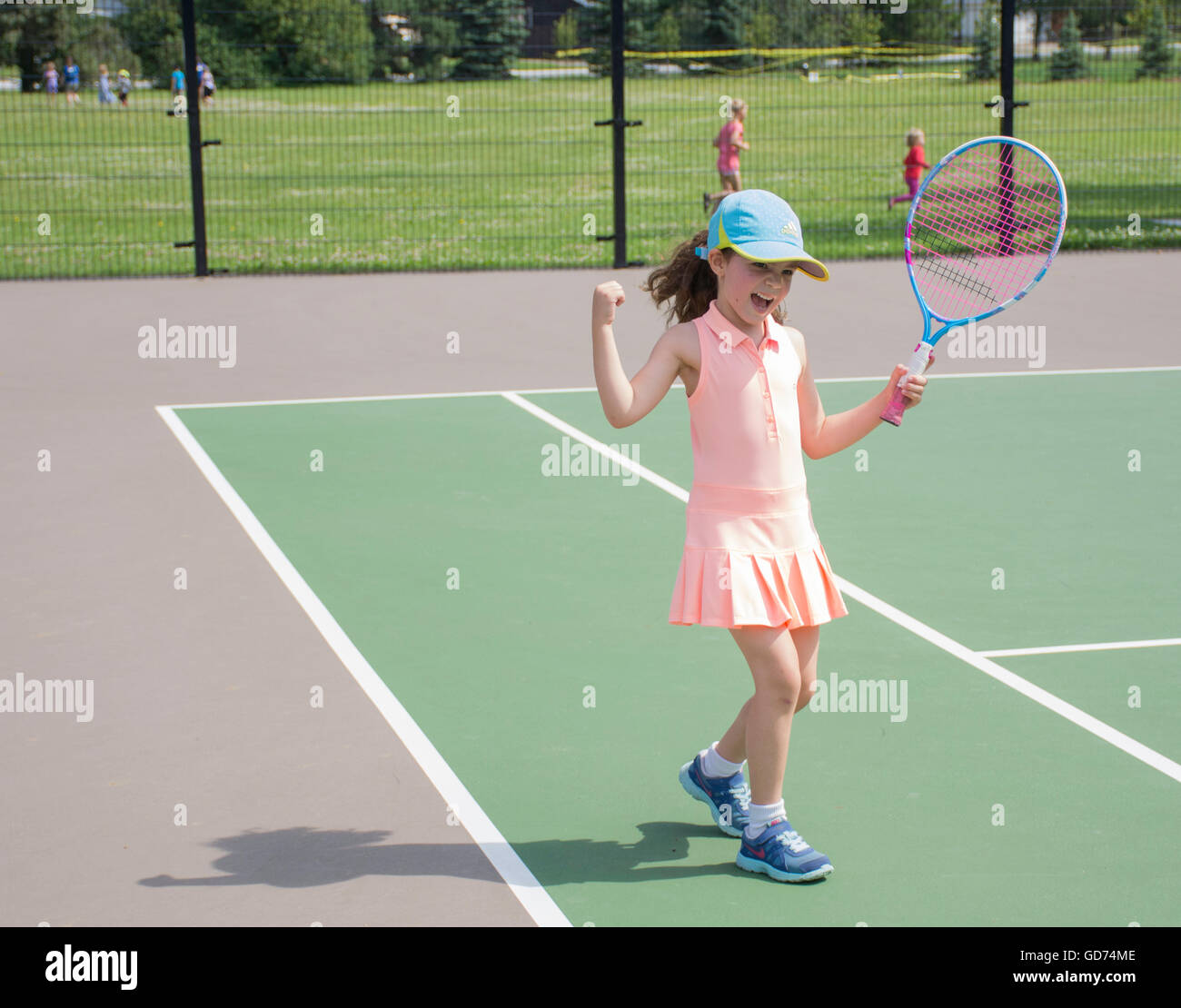 Girl winning at tennis Stock Photo - Alamy