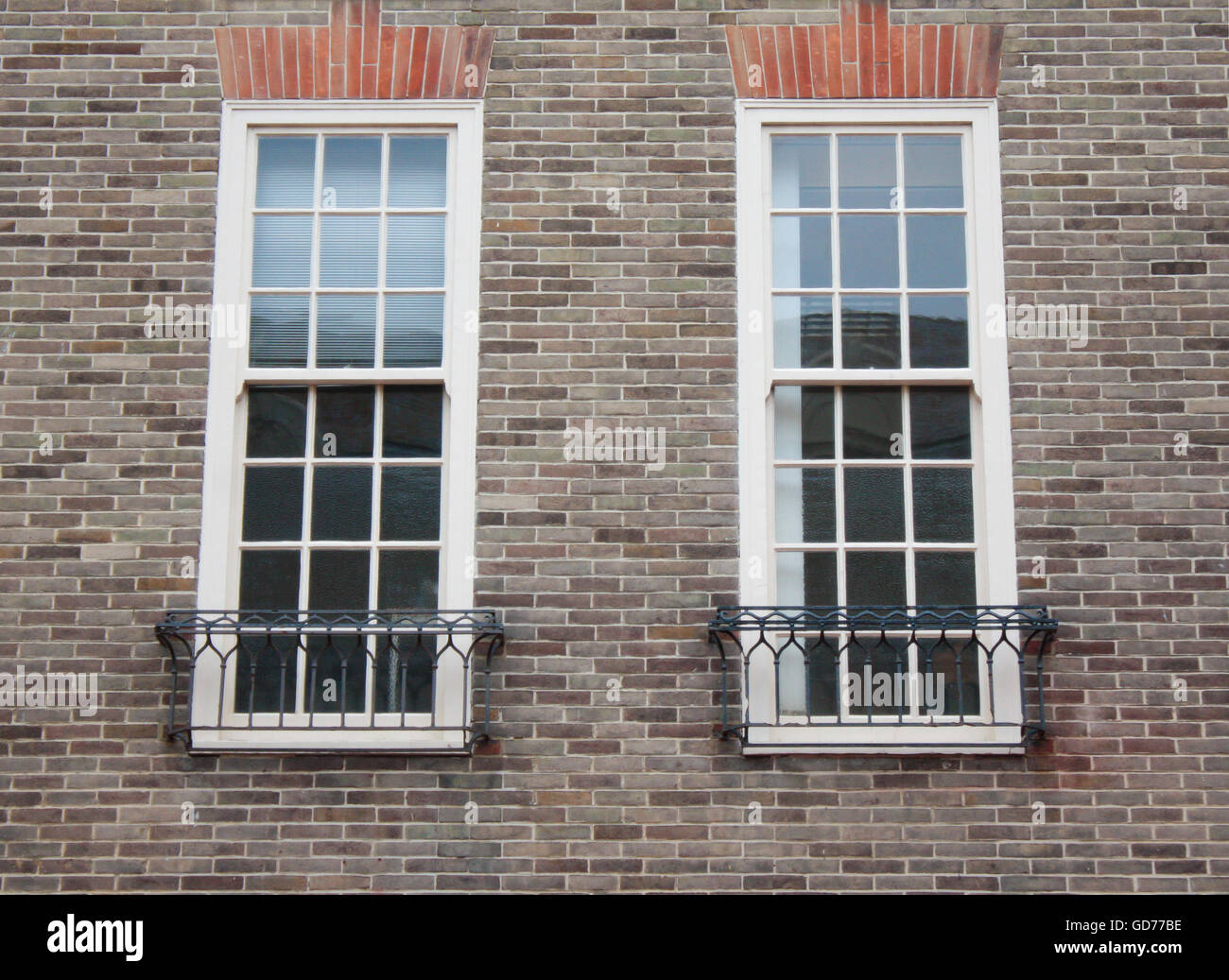 Two windows on brick hi-res stock photography and images - Alamy