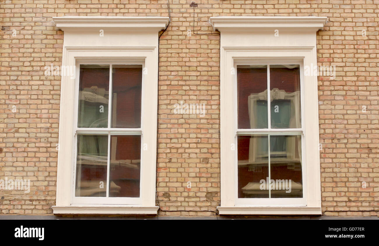 Pair of british window (facade view Stock Photo - Alamy