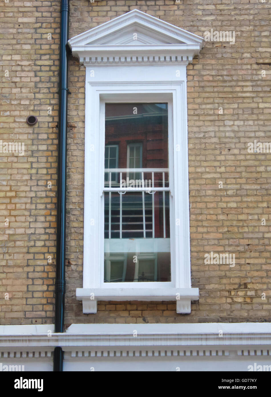 British Window with reflection Stock Photo - Alamy