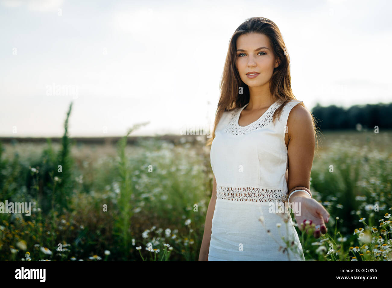 Beautiful girl enjoying daisy field happy flower woman hi-res stock ...