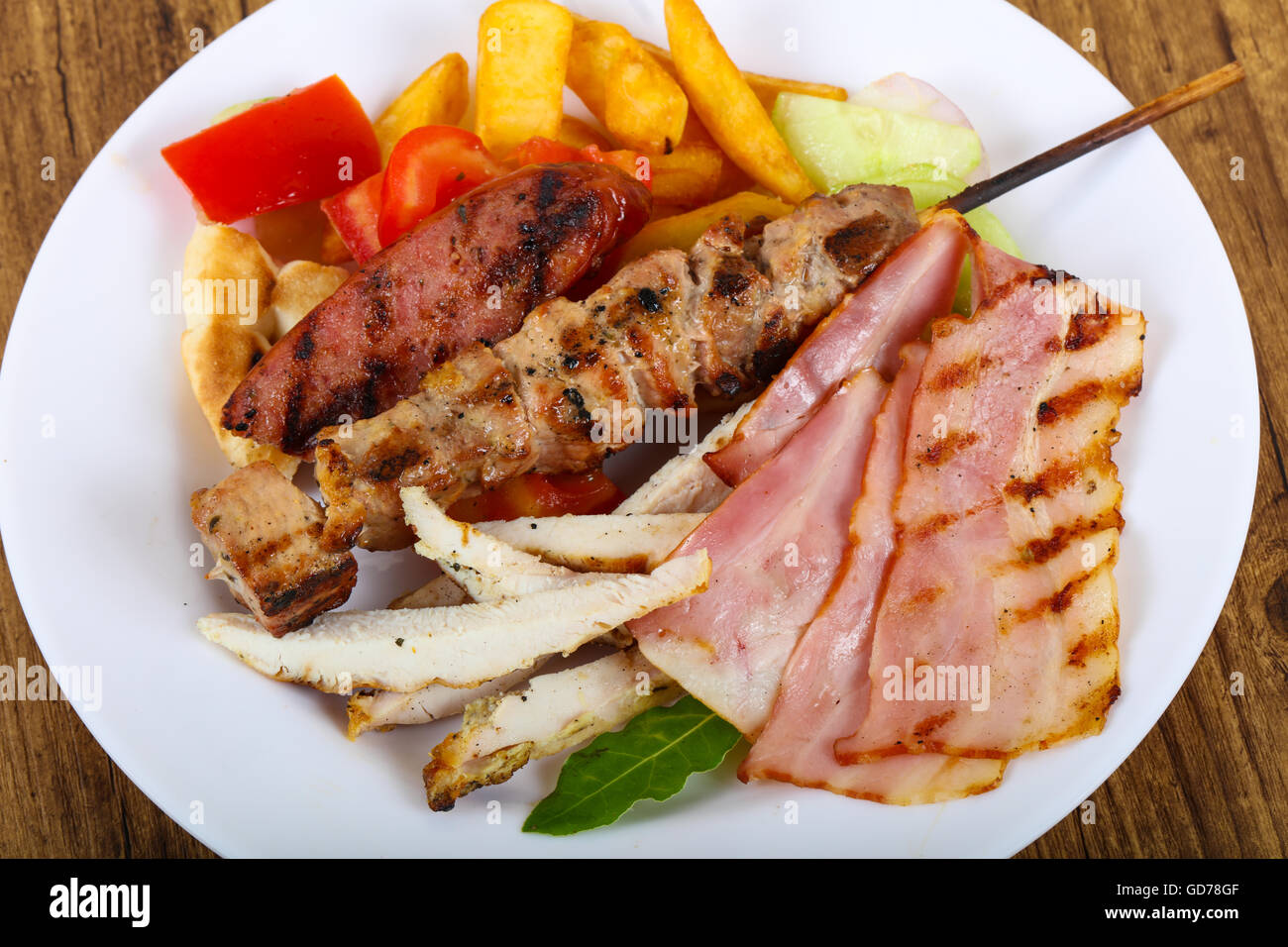 Grill meat mix with potato and tomato Stock Photo - Alamy